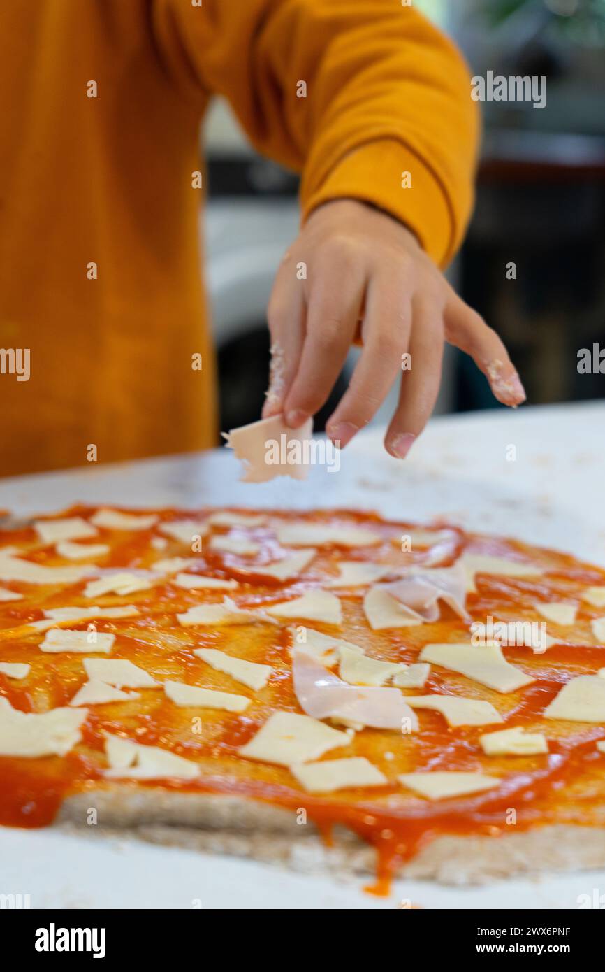 Adding toppings hi-res stock photography and images - Alamy