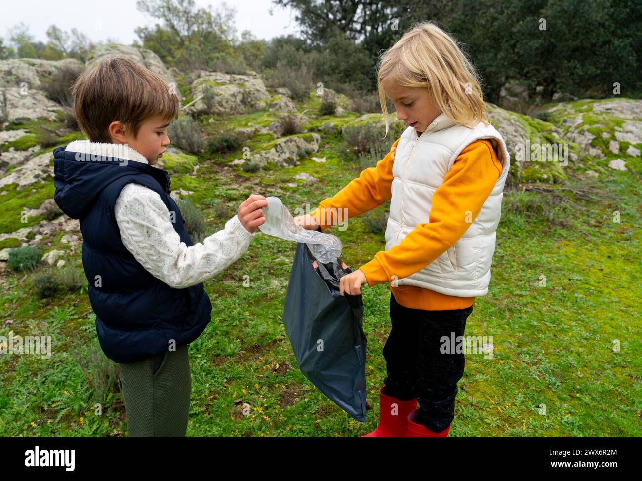 Children cleaning the field of garbage Stock Photo - Alamy