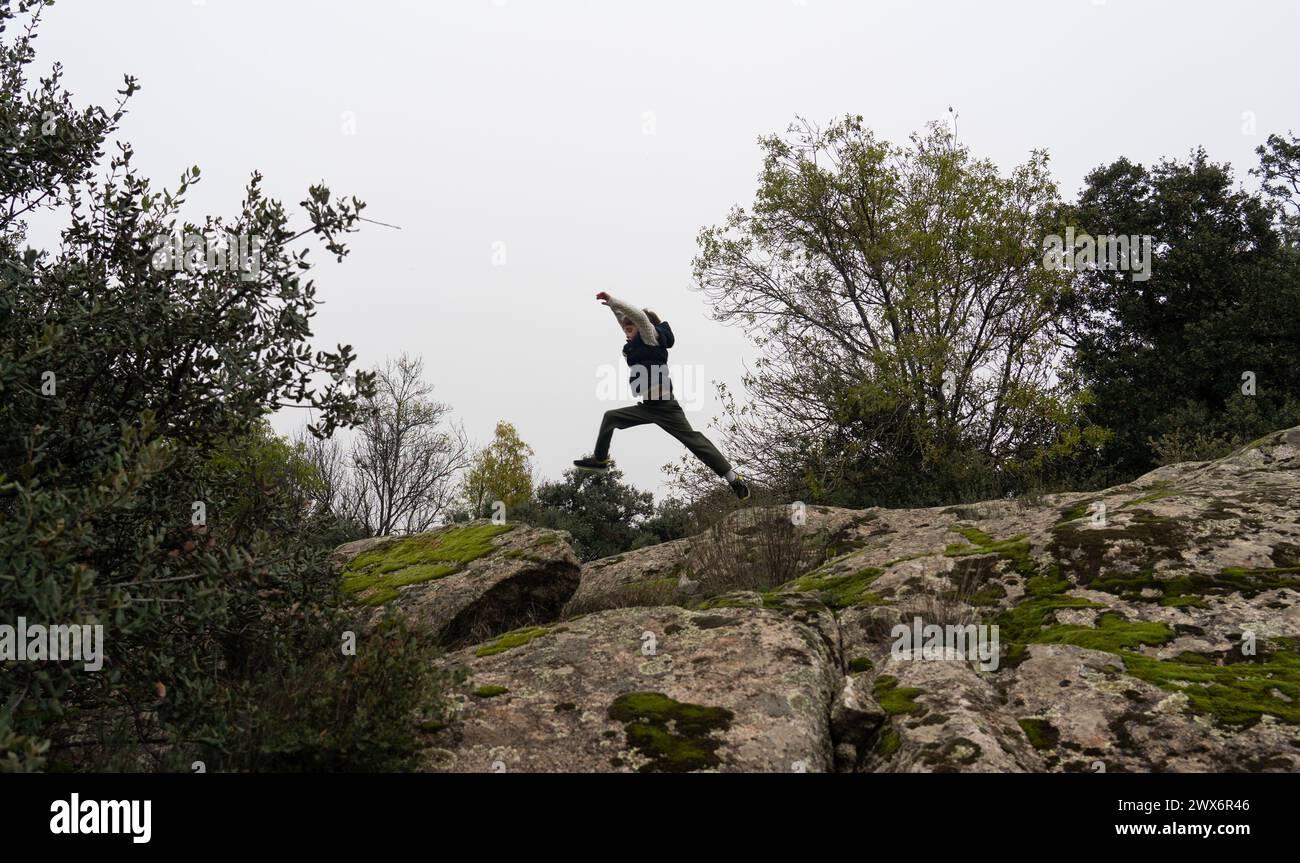 Jumping between rocks hi-res stock photography and images - Alamy