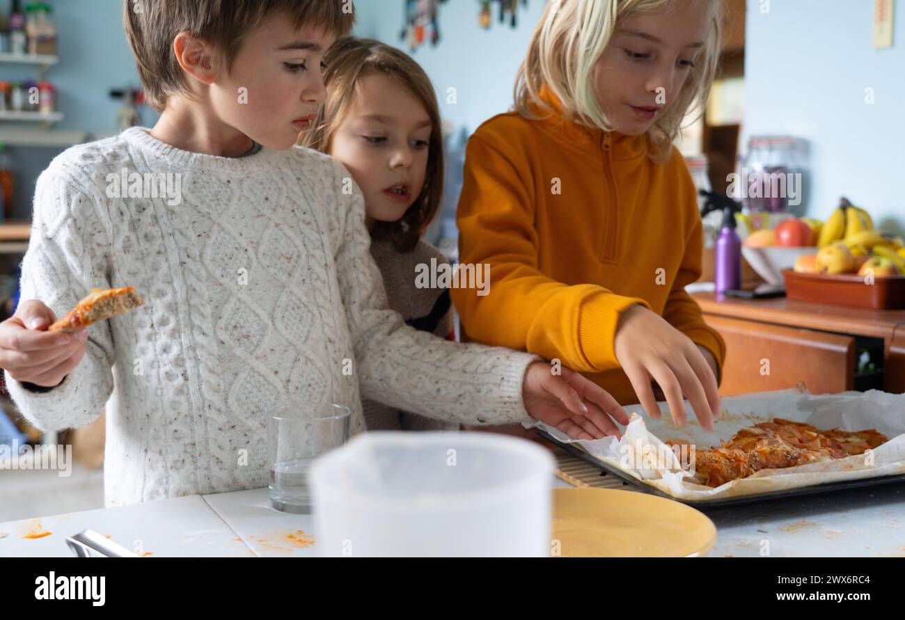 Three children eating hi-res stock photography and images - Alamy