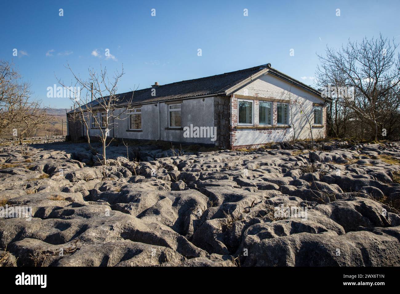 A remote building / outdoor centre sat on a limestone pavement in the ...