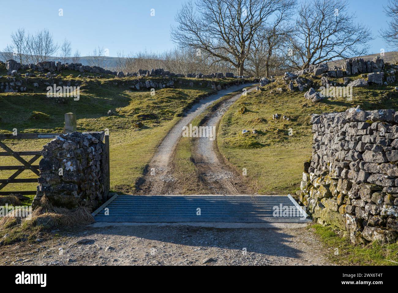 A cattle grid & rough farm track in the North Yorkshire countryside ...
