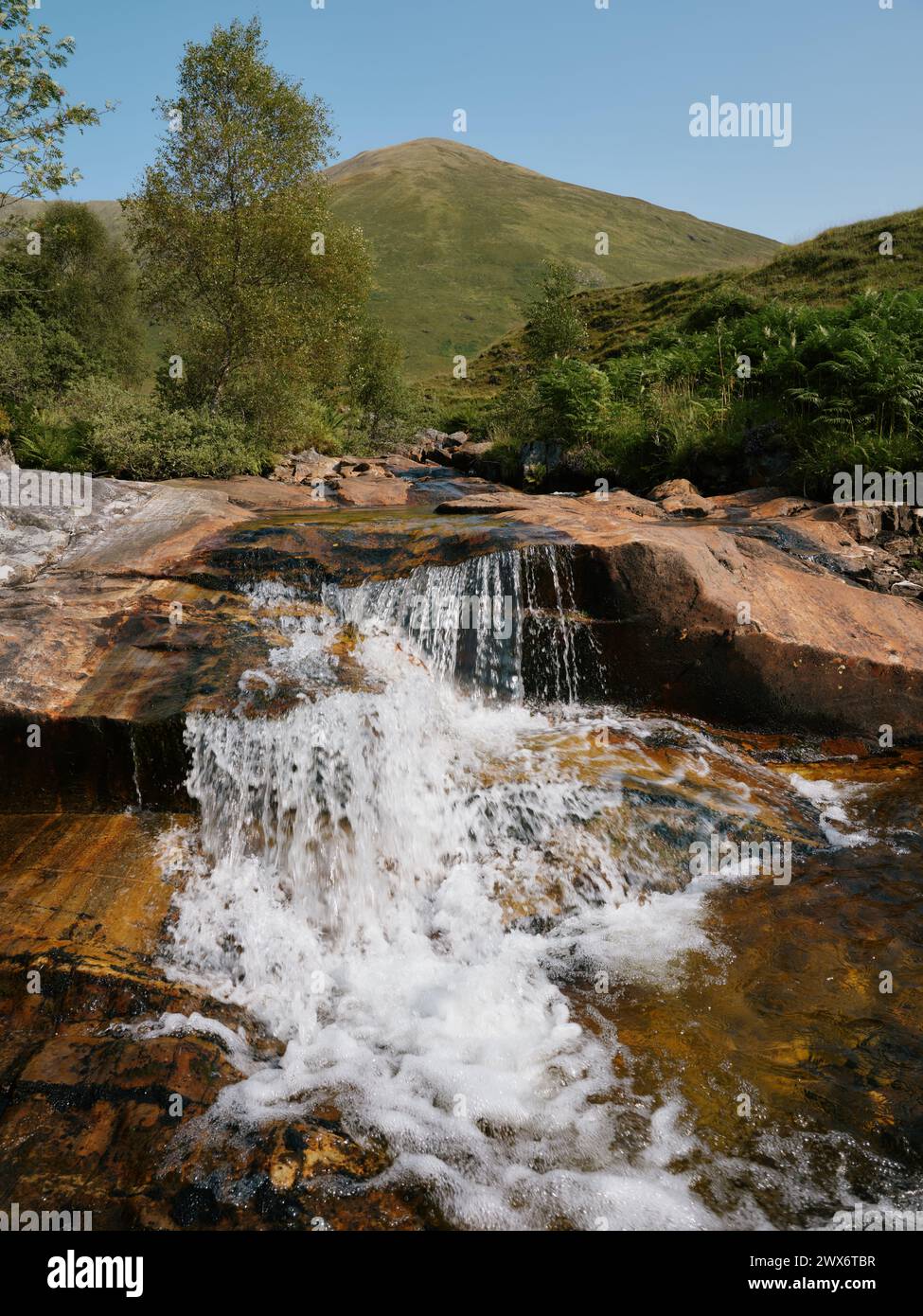 A clean fresh free flowing scottish highland mountain river stream ...
