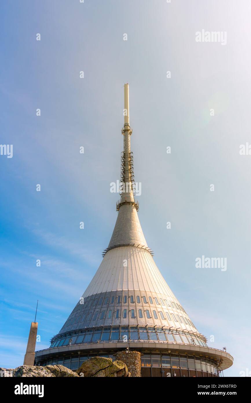 The Jested Tower, with its unique cone-shaped architecture, stands tall under a clear blue sky ...