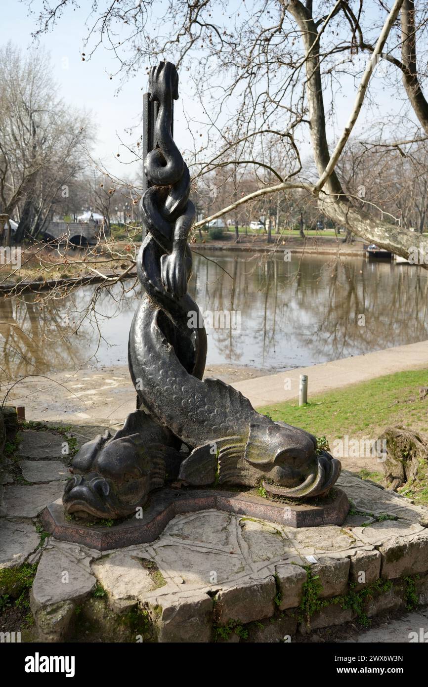 Iron statue of entwined dolphins (1859) outside Vajdahunyad Castle in ...