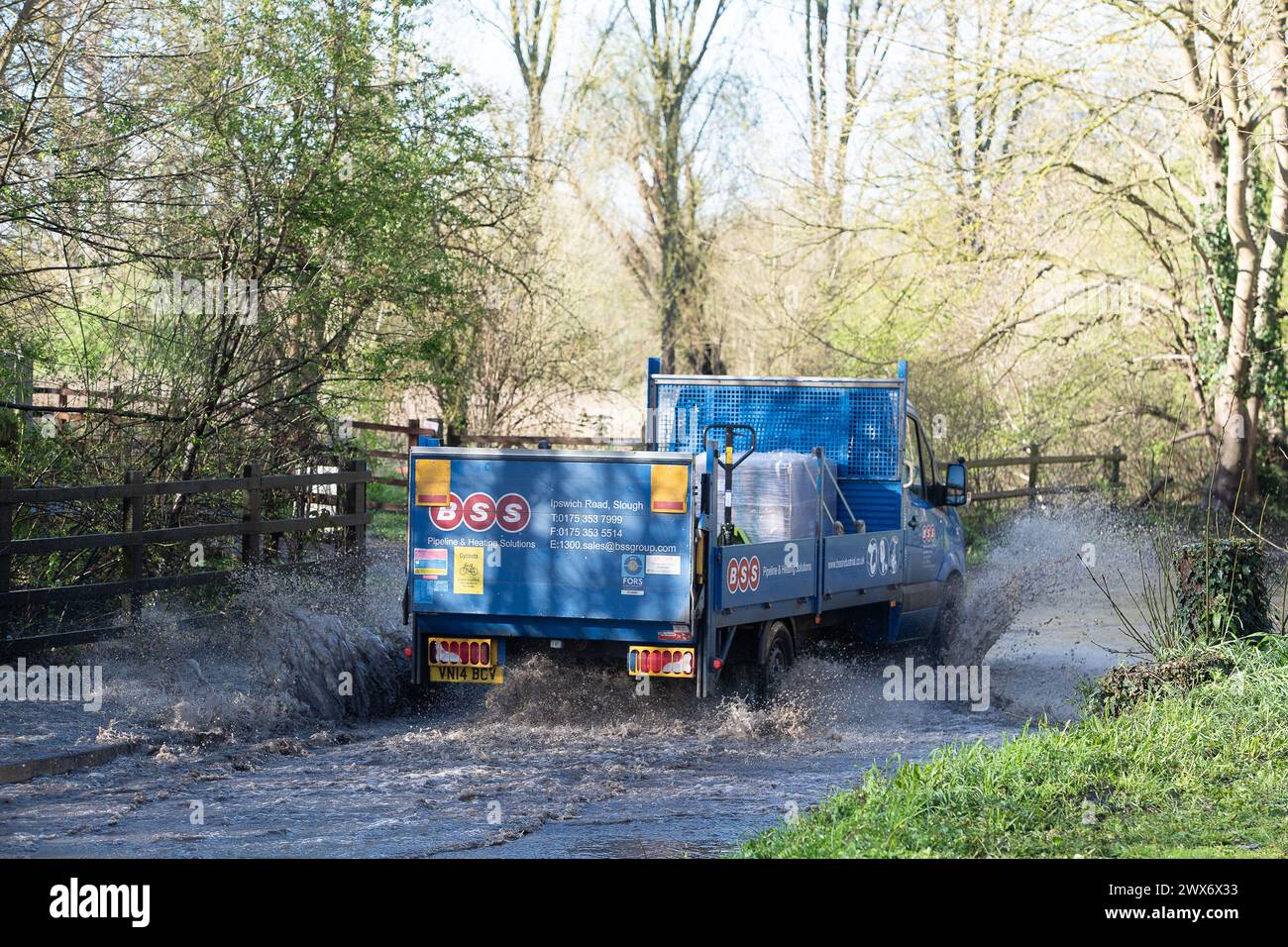 Eton, Windsor, Berkshire, UK. 28th March, 2024. Vehicles splash through ...