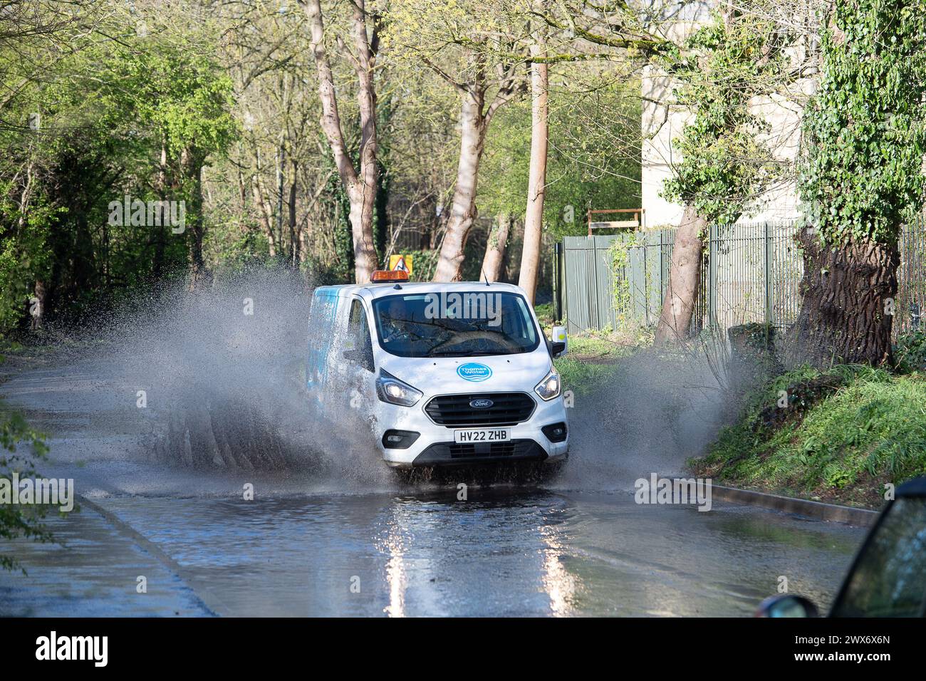 Eton, Windsor, Berkshire, UK. 28th March, 2024. Vehicles splash through ...