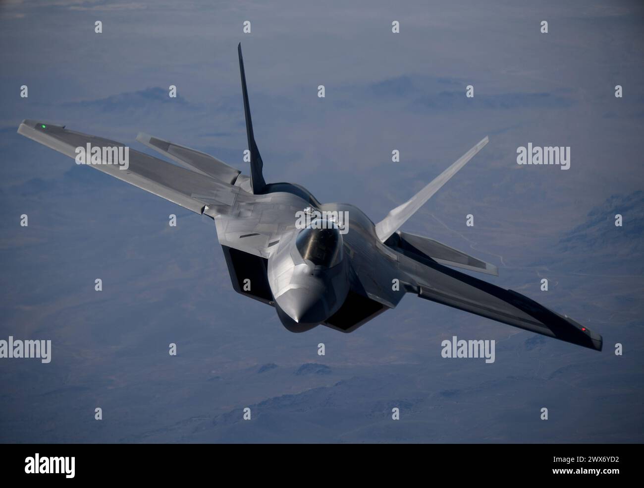 An F-22 Raptor from Langley Air Force Base, Virginia approaches for ...