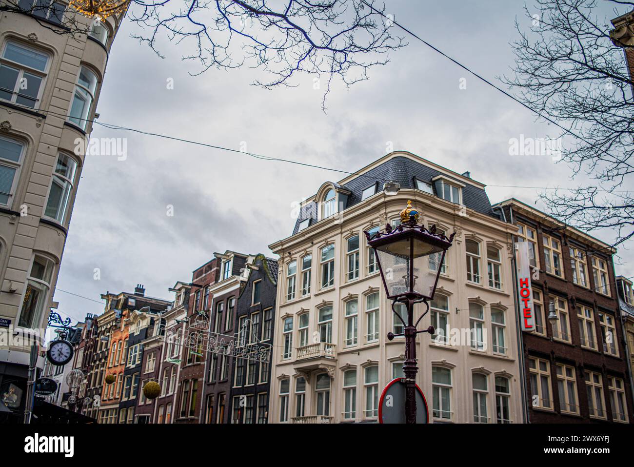 Amsterdam's streets come alive with charming buildings, showcasing historic Dutch architecture ...