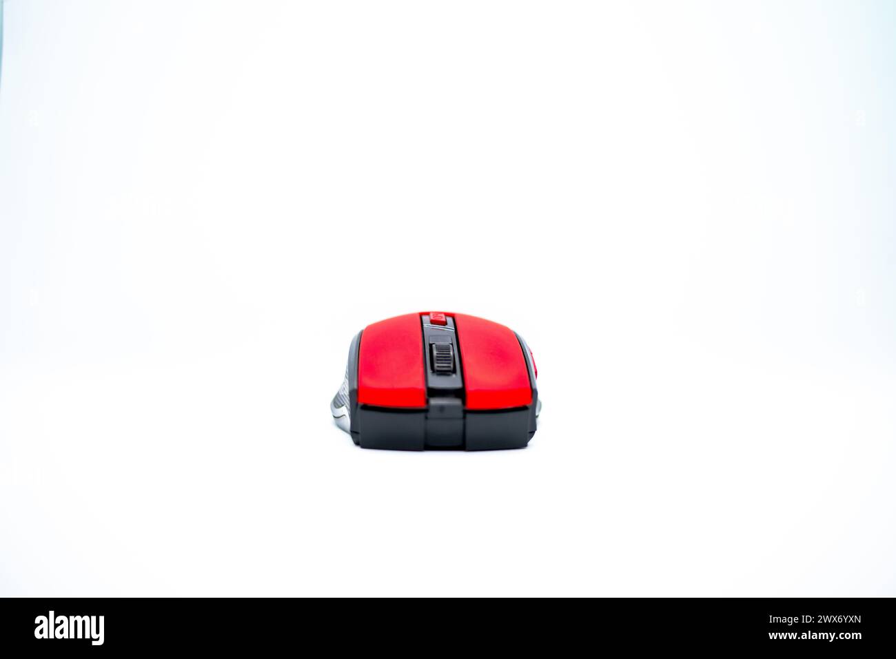 A sleek red mouse on a clean white background, blending style with ...