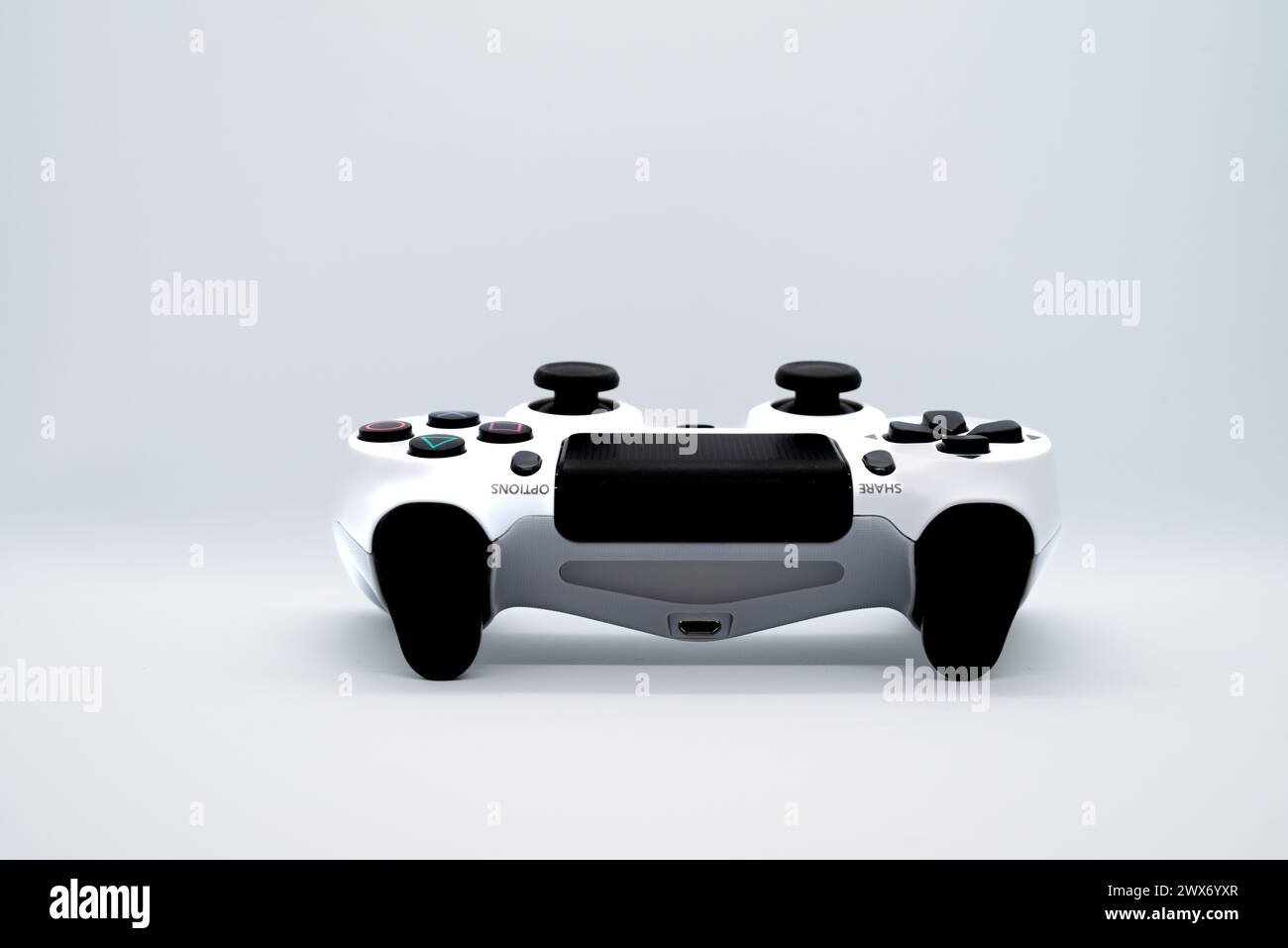 Immerse yourself in the world of gaming with a sleek white gamepad, the ...