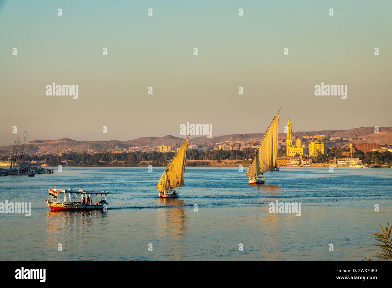 Feluccas (traditinal egyptian sailing boats) on the Nile river at ...