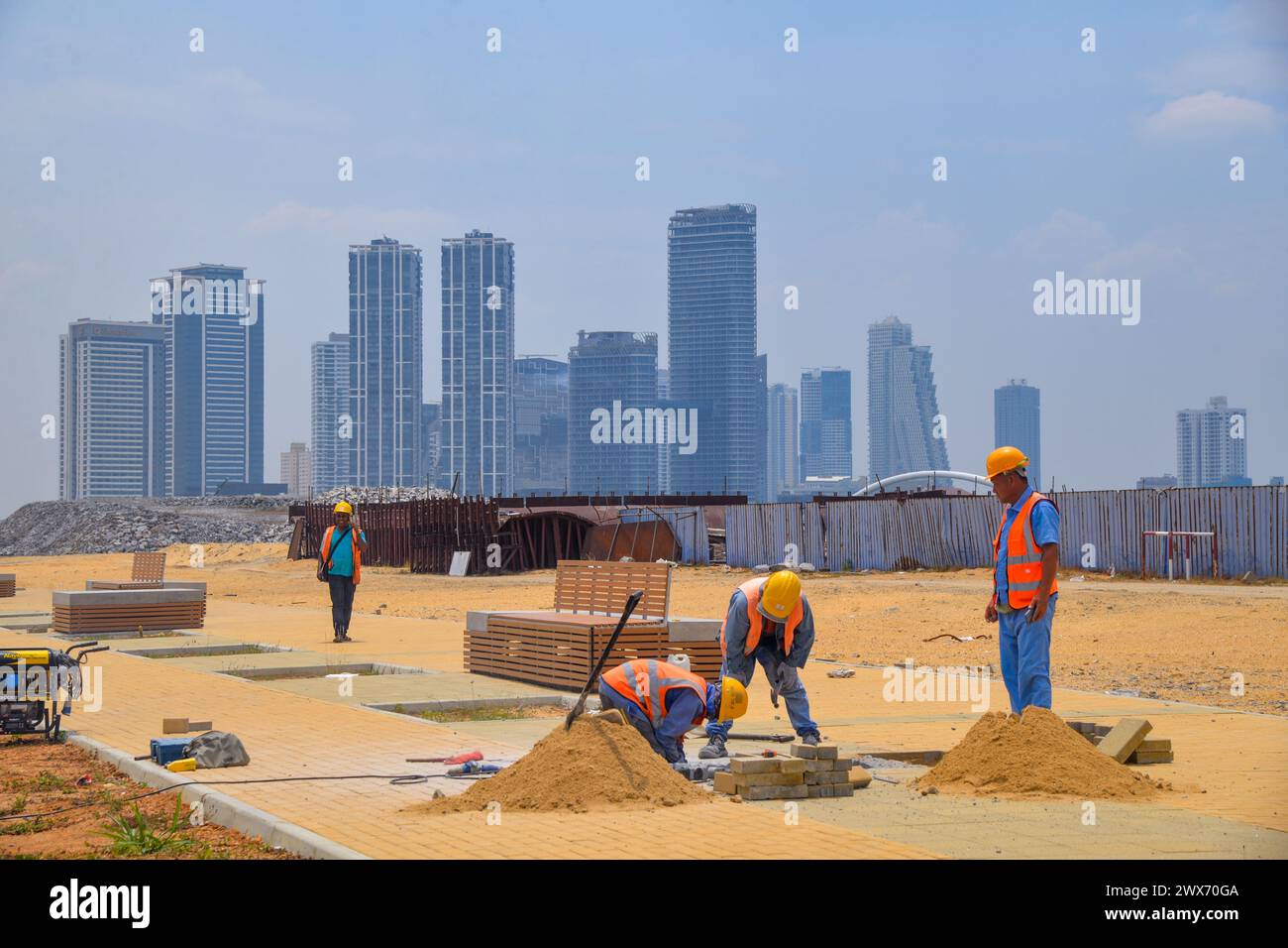 Colombo. 27th Mar, 2024. Workers work at a construction site of the Colombo Port City in Sri ...