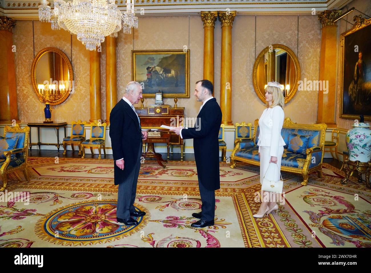 The Ambassador of Moldova, Ruslan Bolbocean presents his credentials to King Charles III (left ...
