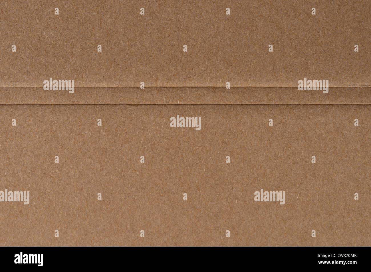 Two crease lines on brown paper surface macro close up view Stock Photo ...
