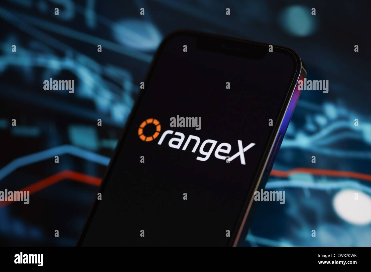 KYIV, UKRAINE - MARCH 15, 2024 OrangeX logo on iPhone display screen ...