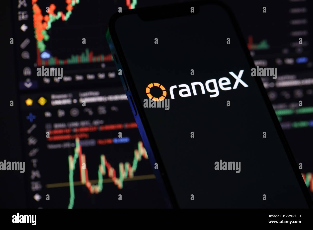 KYIV, UKRAINE - MARCH 15, 2024 OrangeX logo on iPhone display screen ...