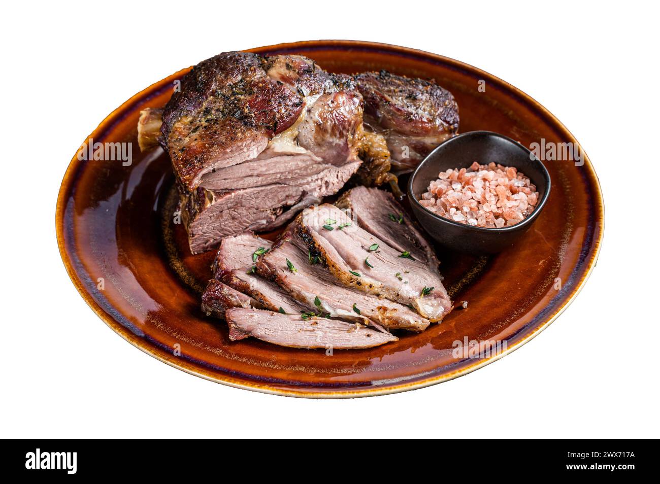 BBQ Roast Lamb mutton leg sliced on a rustic plate. Isolated on white ...