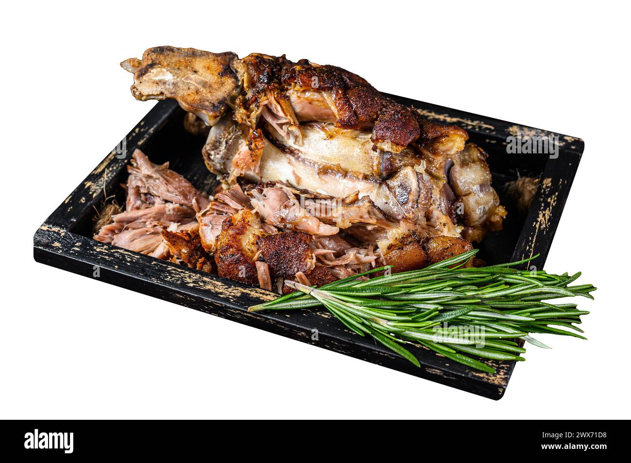Roasted pork knuckle eisbein meat in a wooden tray with knife. Isolated ...