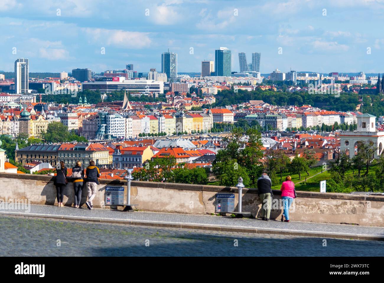 Visitors looking out over the modern skyline of Pankrac set against the ...