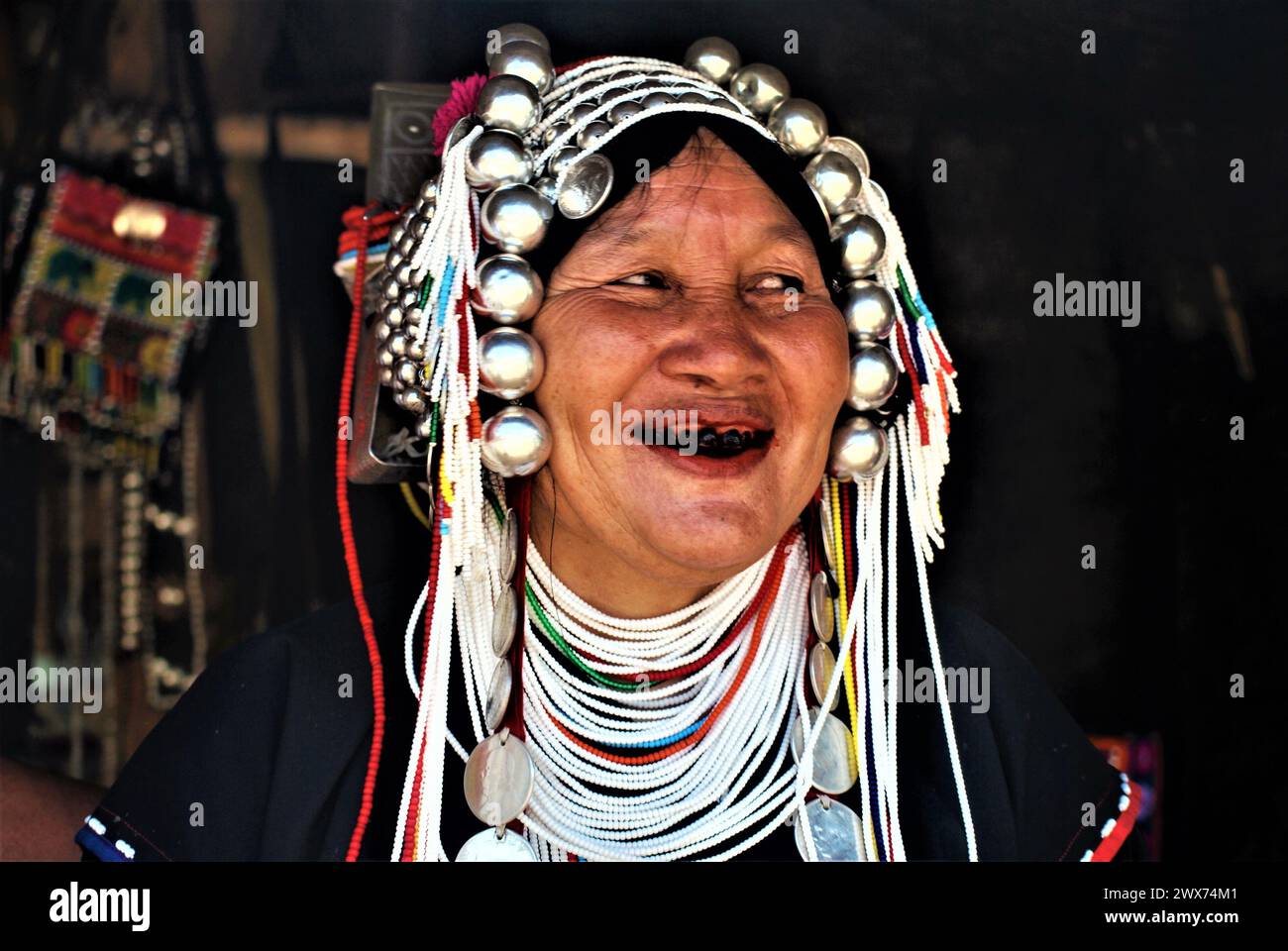 akha, women with headdress and traditional clothing in village in ...