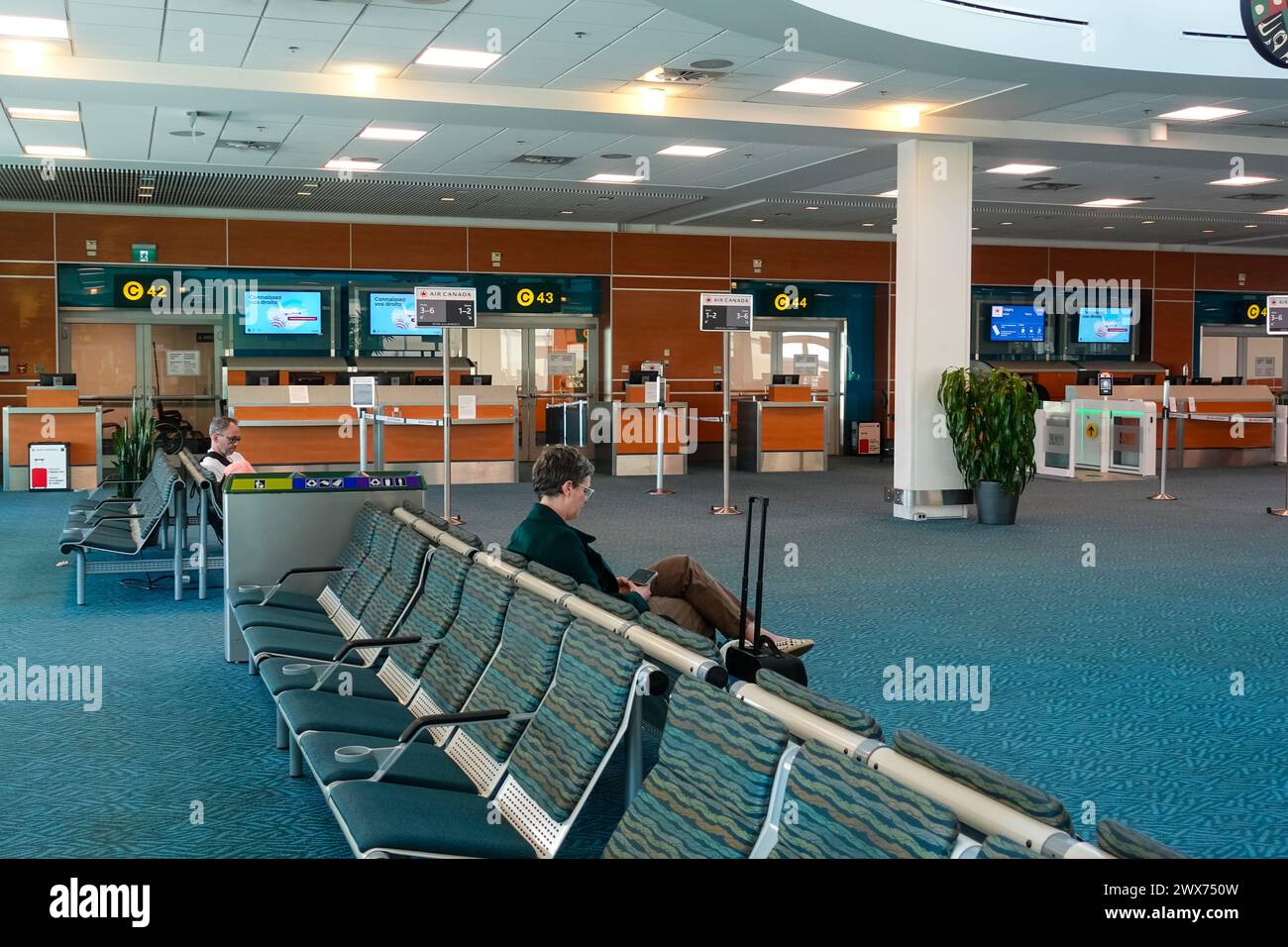 half empty airport gate inside vancouver international airport Stock Photo - Alamy