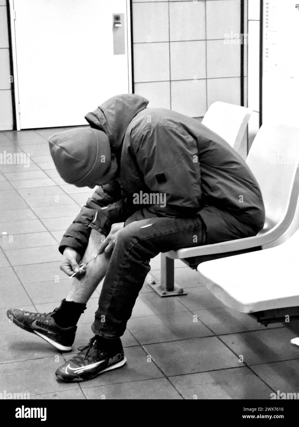 Young drug addict getting a drug fix, Lyon's underground, Lyon, France ...