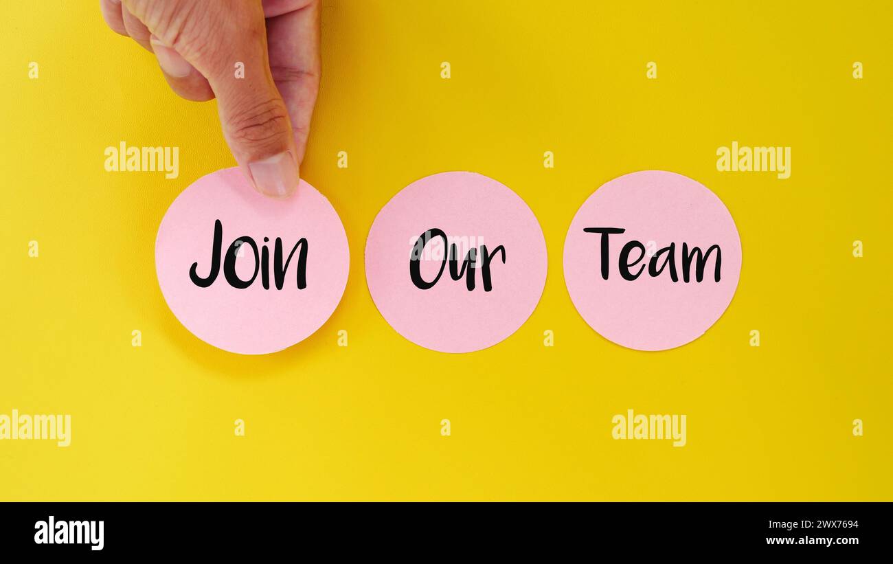 Hand holding JOIN OUR TEAM paper. Job vacancy concept Stock Photo - Alamy
