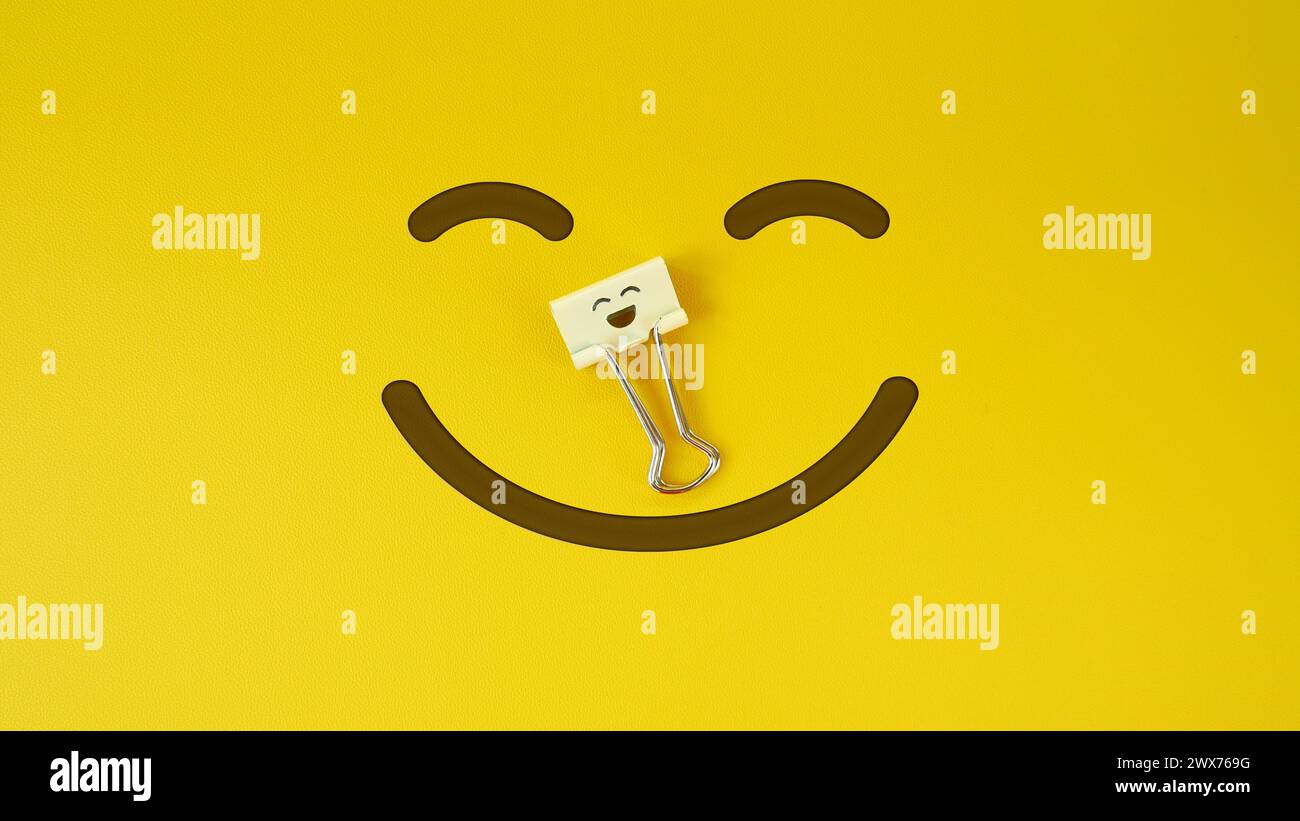 Smile emoticon paper clip. Smiling face in yellow background. Copy ...