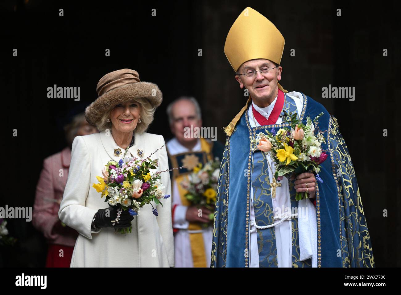 Bishop of Worcester, John Inge, stands with Queen Camilla as she leaves ...