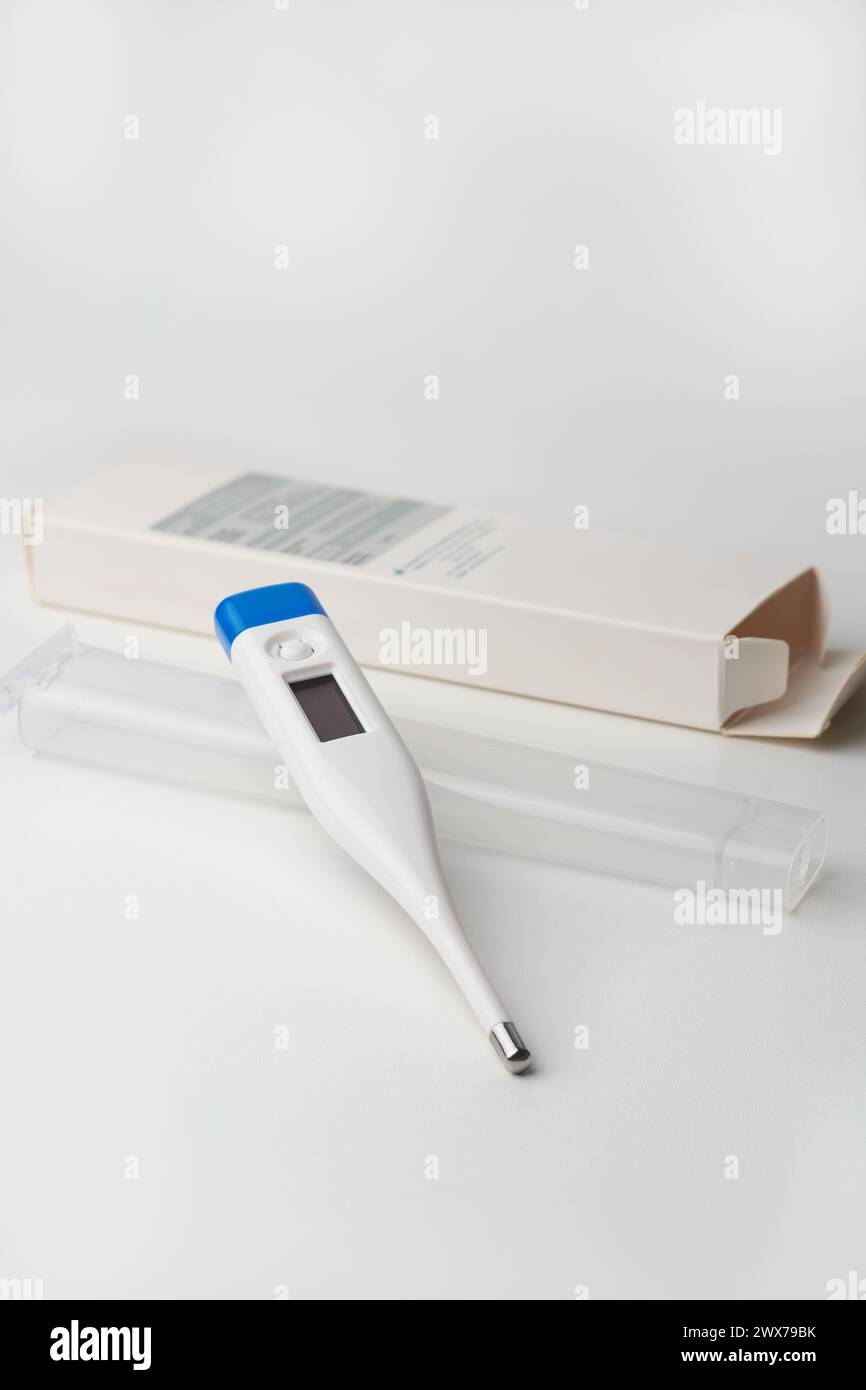 modern digital thermometer with box and plastic cover, electronic ...