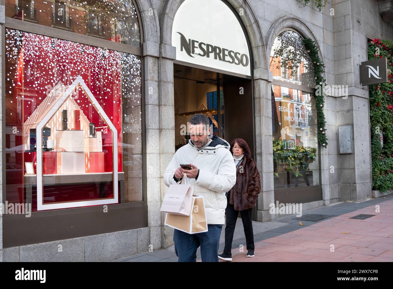 Pedestrians walk past the Swiss high-end and world leader in coffee ...