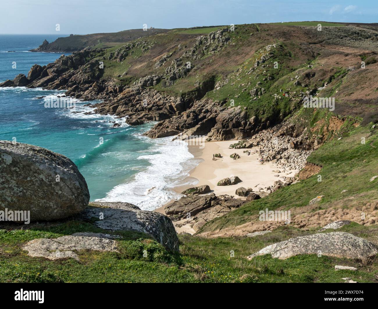 Small sandy beach of Porth Chapel Cove near Porthcurno, South Cornwall ...