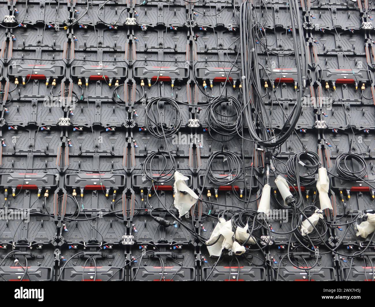 Close-up, rear view of one of the giant banks of TV screens with all ...