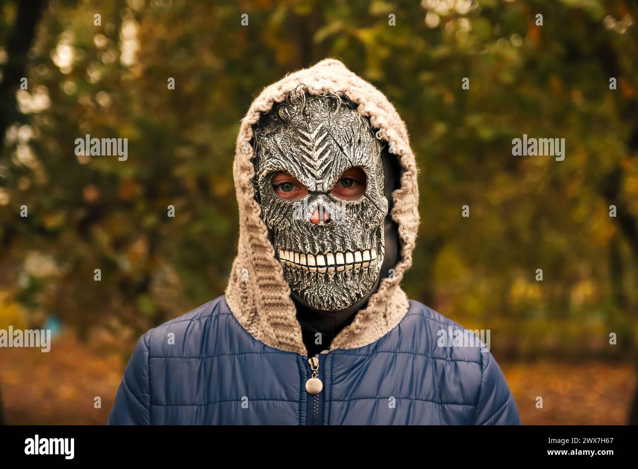 Halloween people portrait. Person in grim reaper mask standing on ...