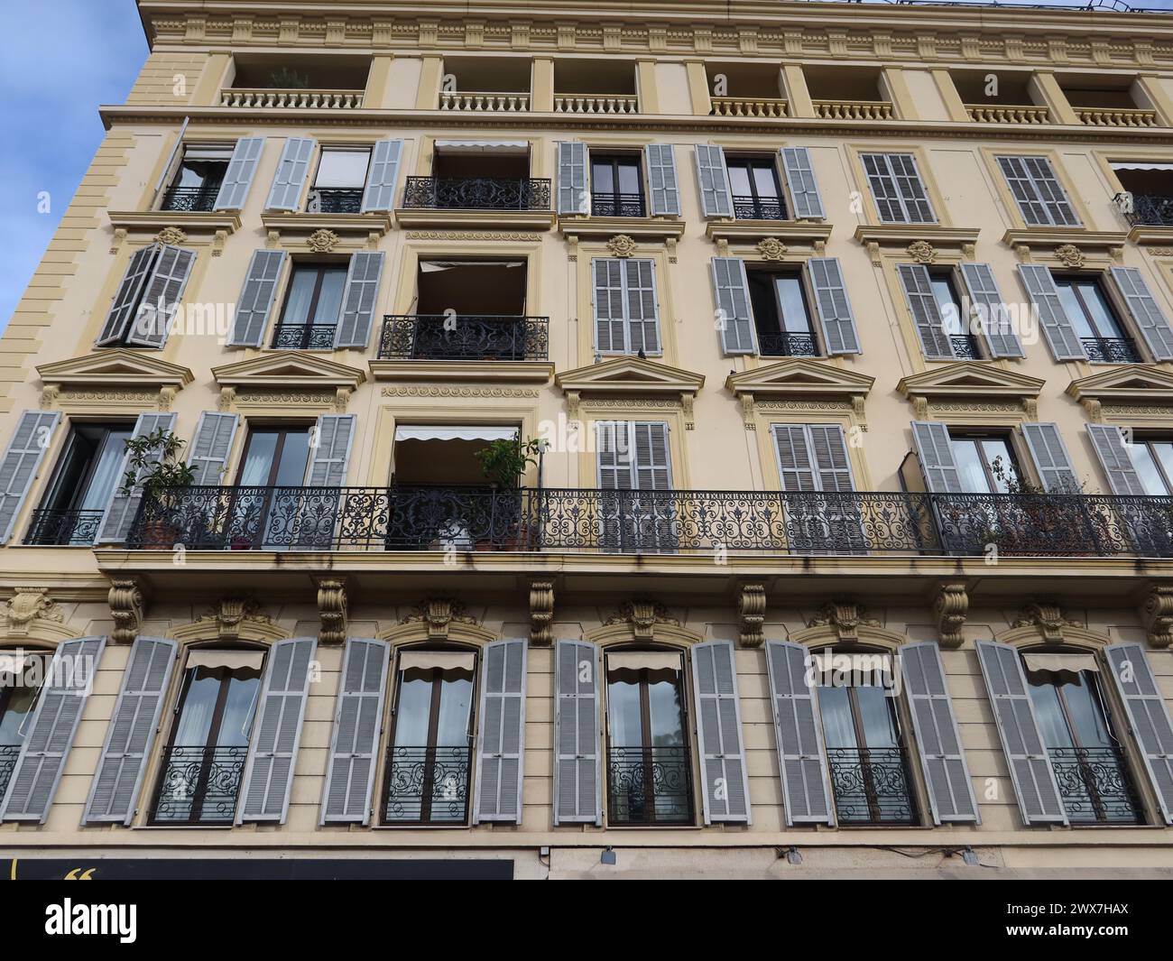 Tall windows, shutters, balconies & coloured render are the features of ...