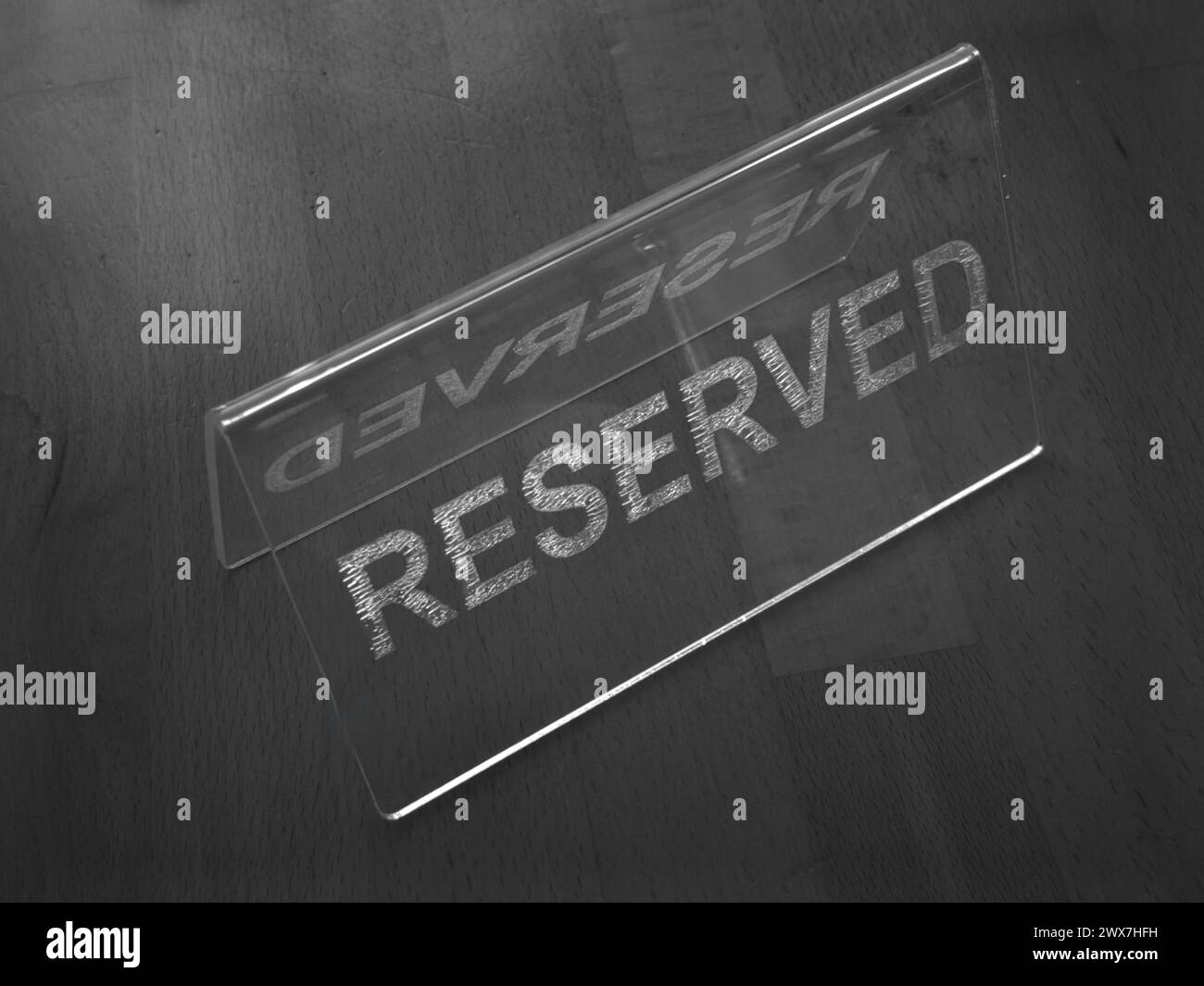 Monochrome Minimalism. Reserved Plastic Sign, on table. Black and white ...
