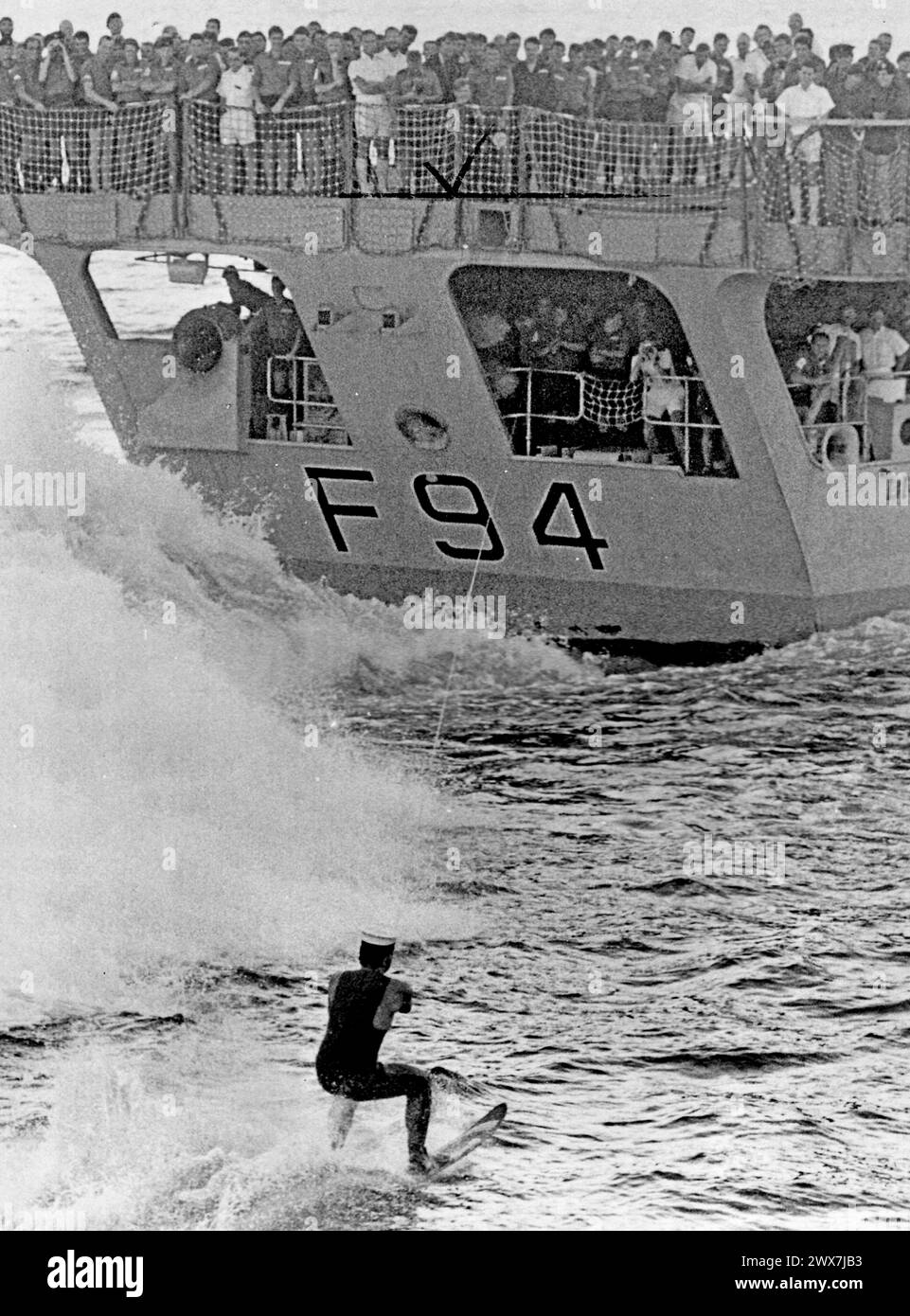 A SAILOR WATER SKI'S BEHIND ROYAL NAVY FRIGATE HMS BRAVE. 1987 PIC MIKE ...
