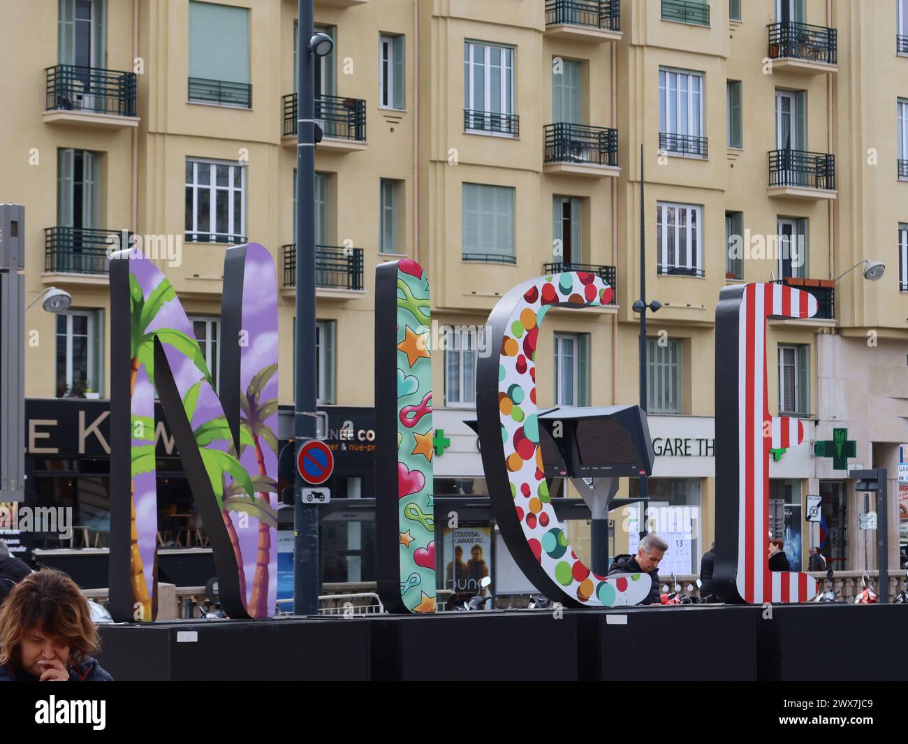 Large decorated capital letters mounted on plinths outside the station ...