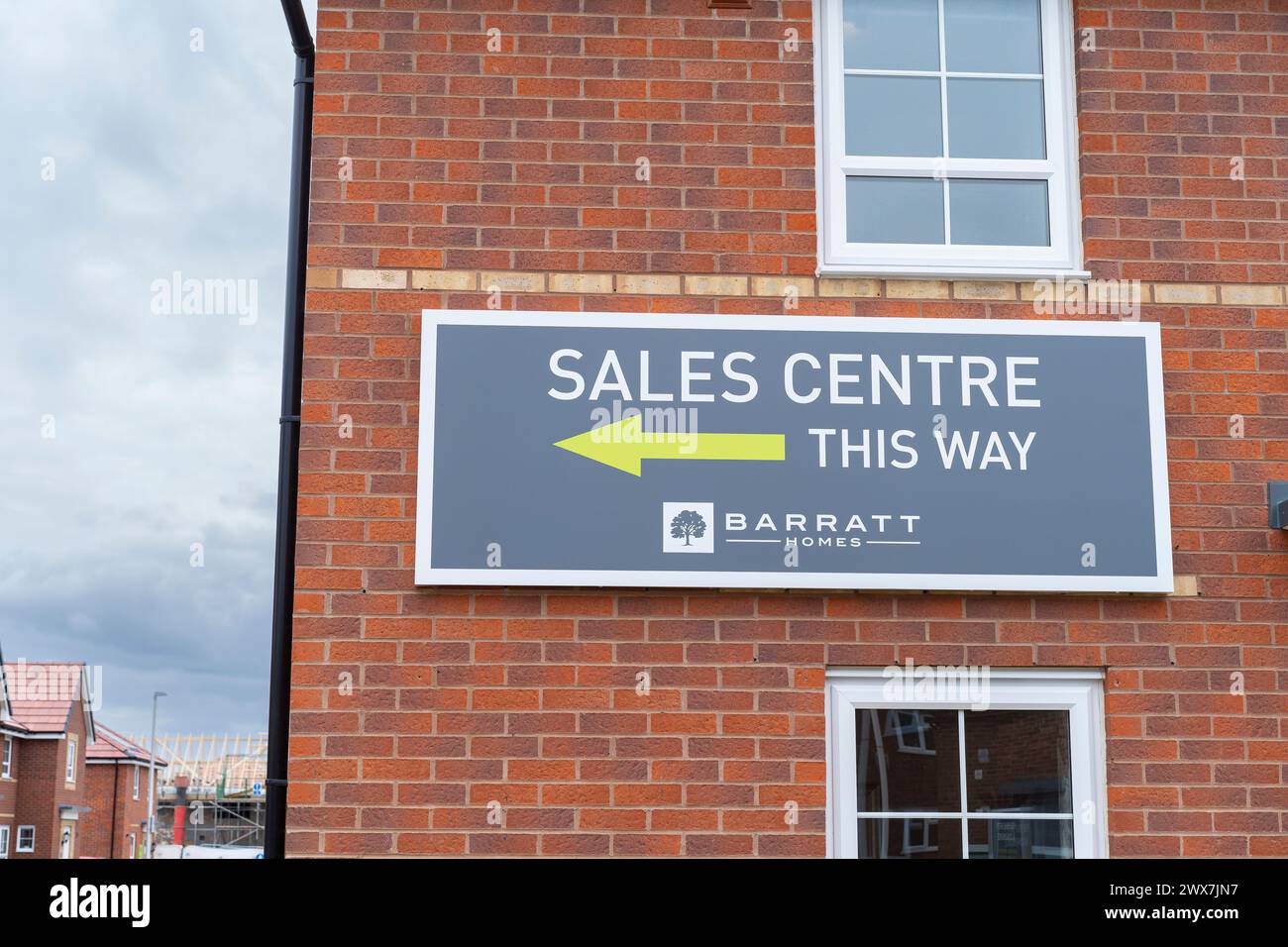 Barratt Homes Sales Centre sign fixed to a finished new build home ...