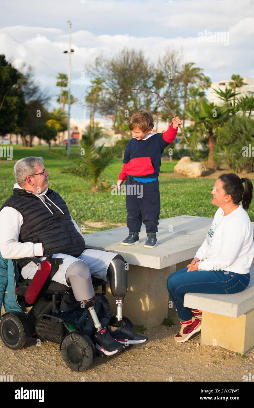 interacting with their parents, they form an inclusive family Stock ...