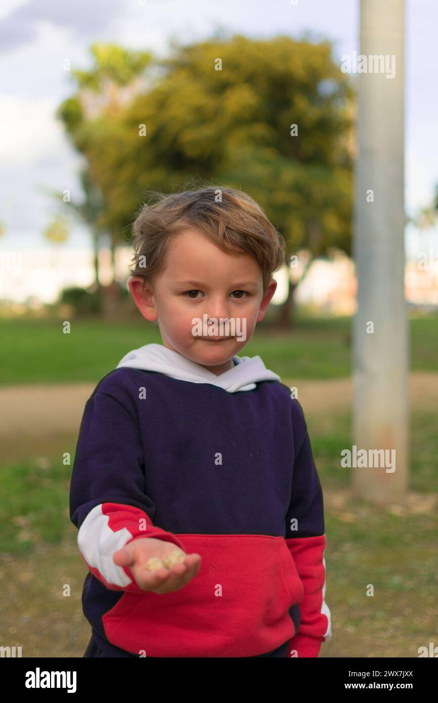 close-up portrait of a boy proudly displaying his stone Stock Photo - Alamy