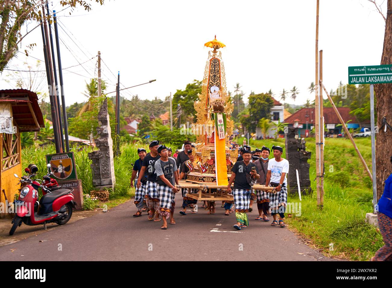 A funeral ceremony on the island of Bali. People in traditional ...