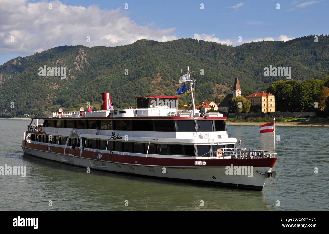 A river cruise ship sails past the village of Hofarnsdorf on the Danube ...