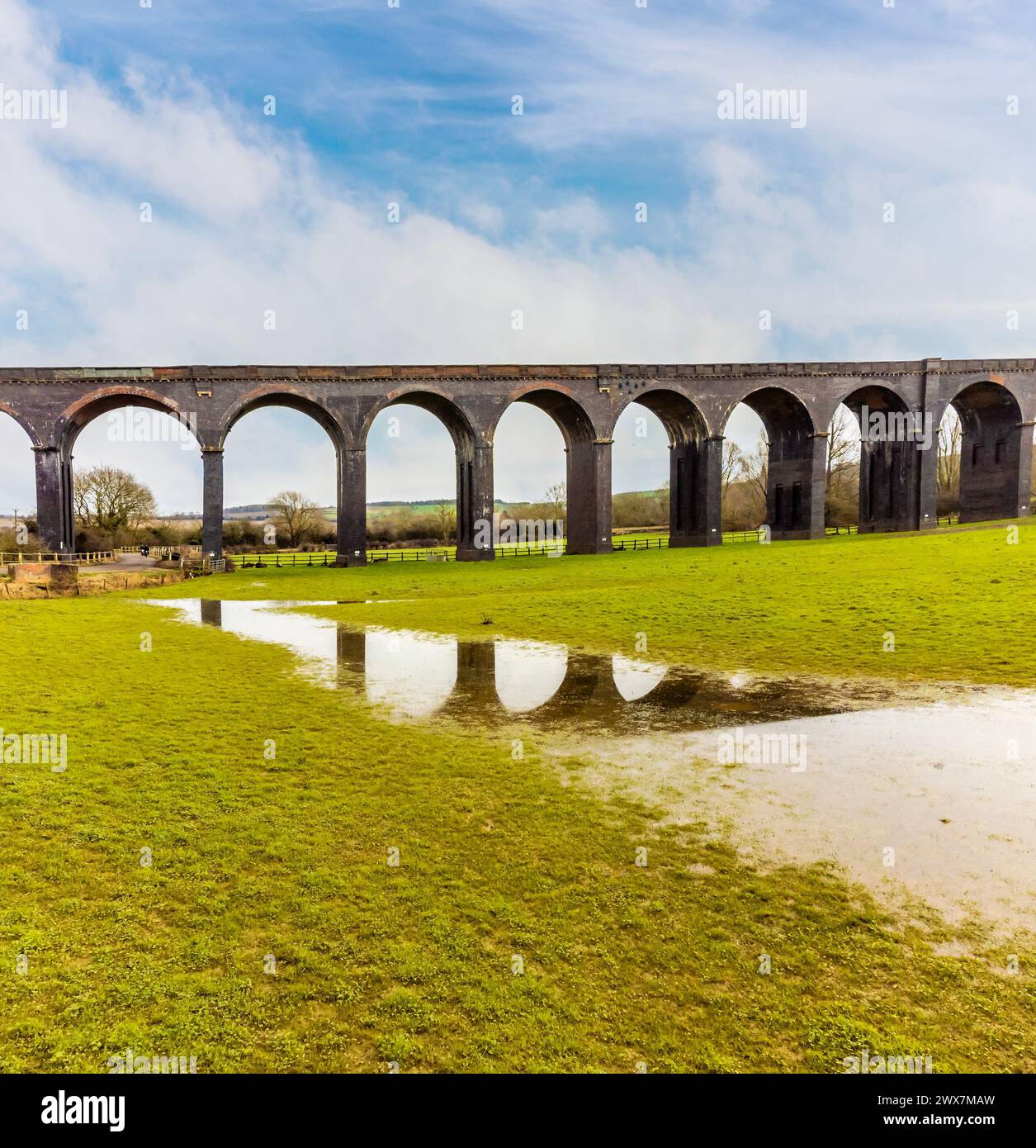 An aerial view of reflections in rain soaked fields beside the ...