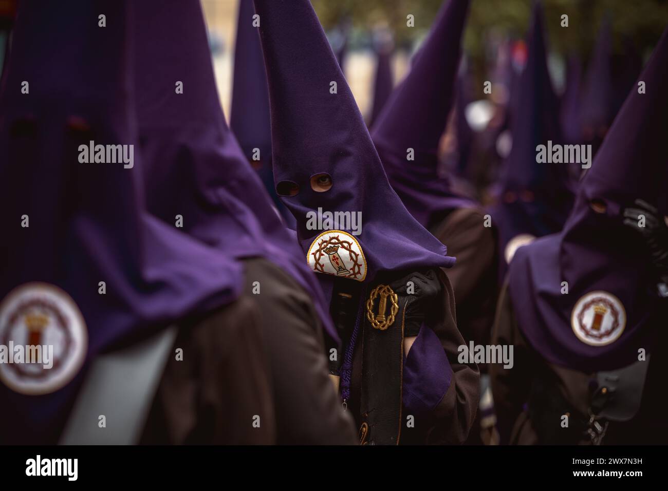 Zaragoza, Spain. 28th Mar, 2024. Hooded penitents take part in a ...