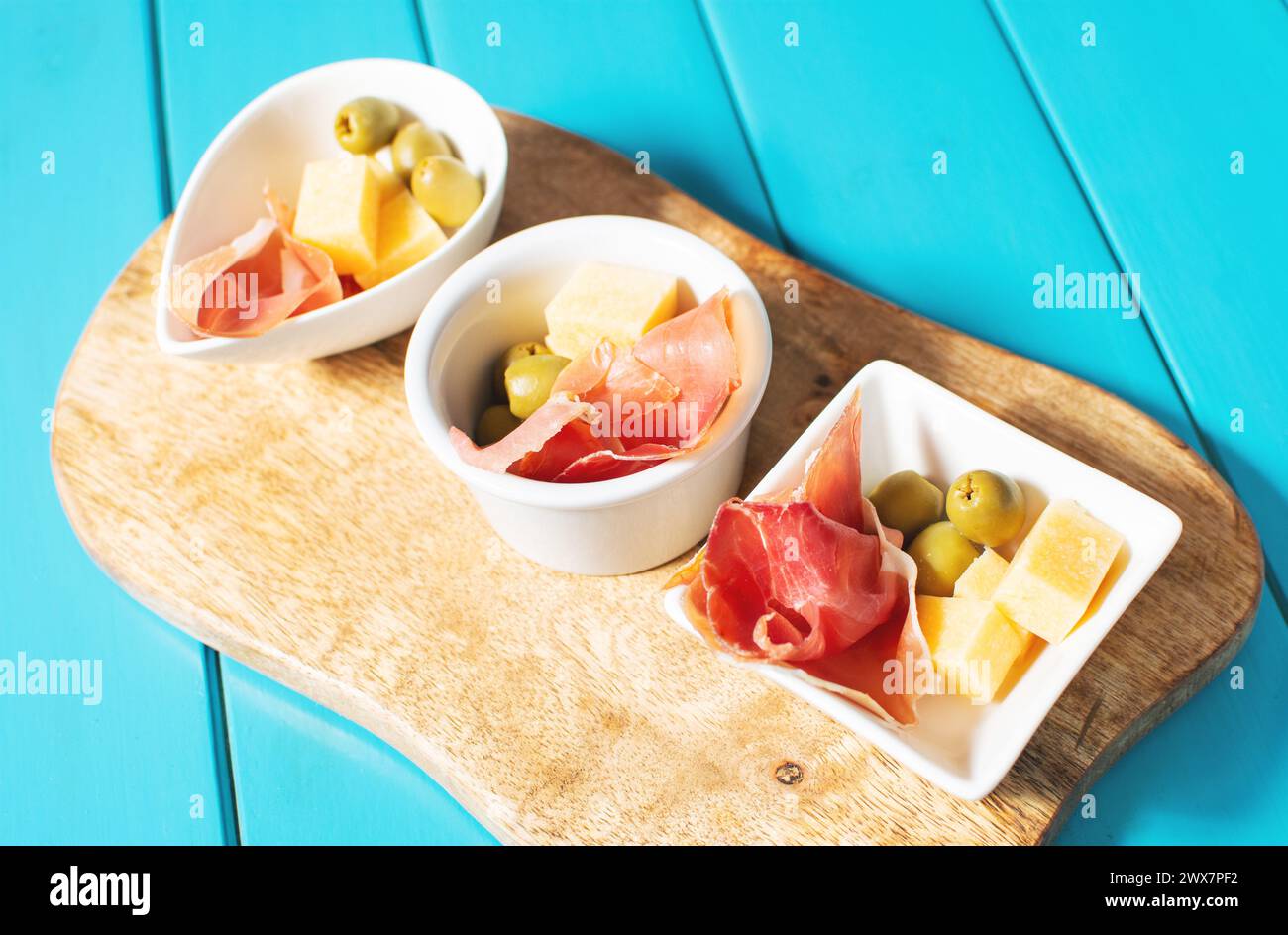 Traditional spanish jamon and cheese. Antipasto plate and olives Stock ...