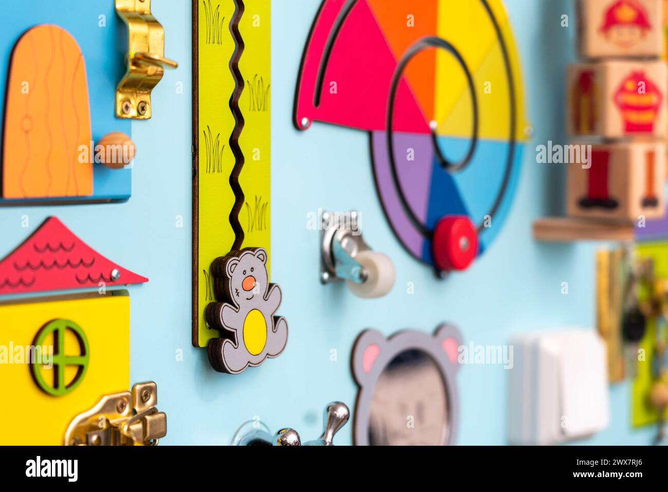 Tactile toys for the development of a child on an entertaining board ...