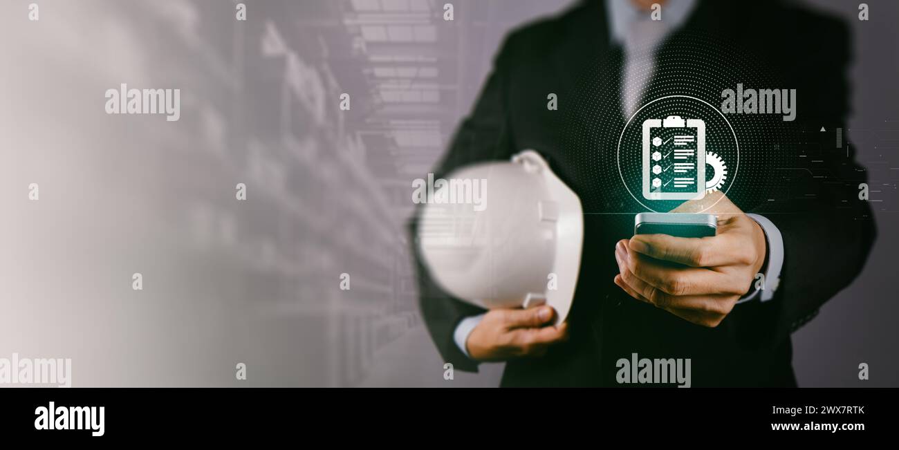 Engineer entrepreneur working on smartphone with virtual screen of the ...