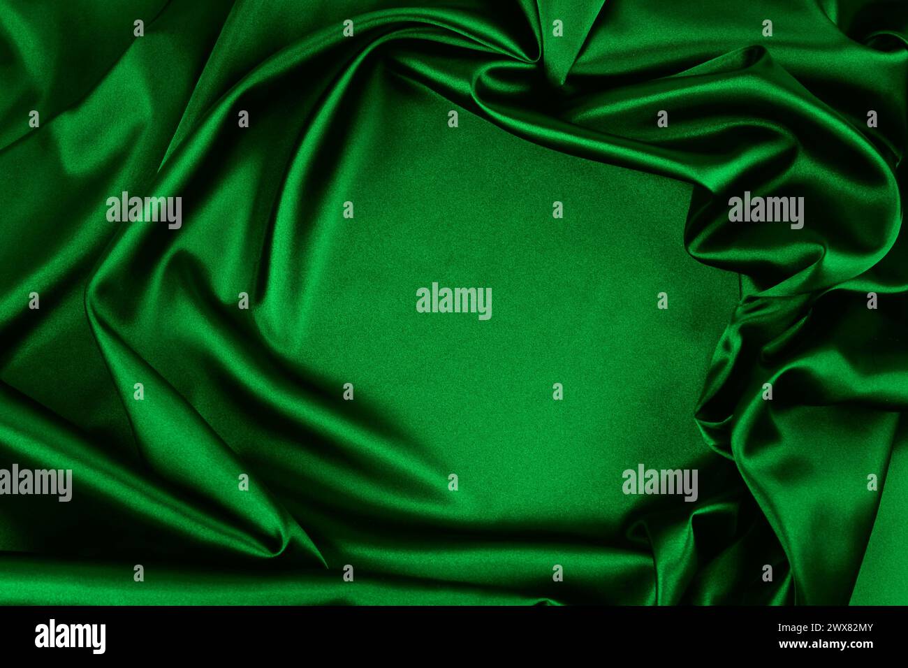 Close-up of rippled green satin silk fabric Stock Photo - Alamy